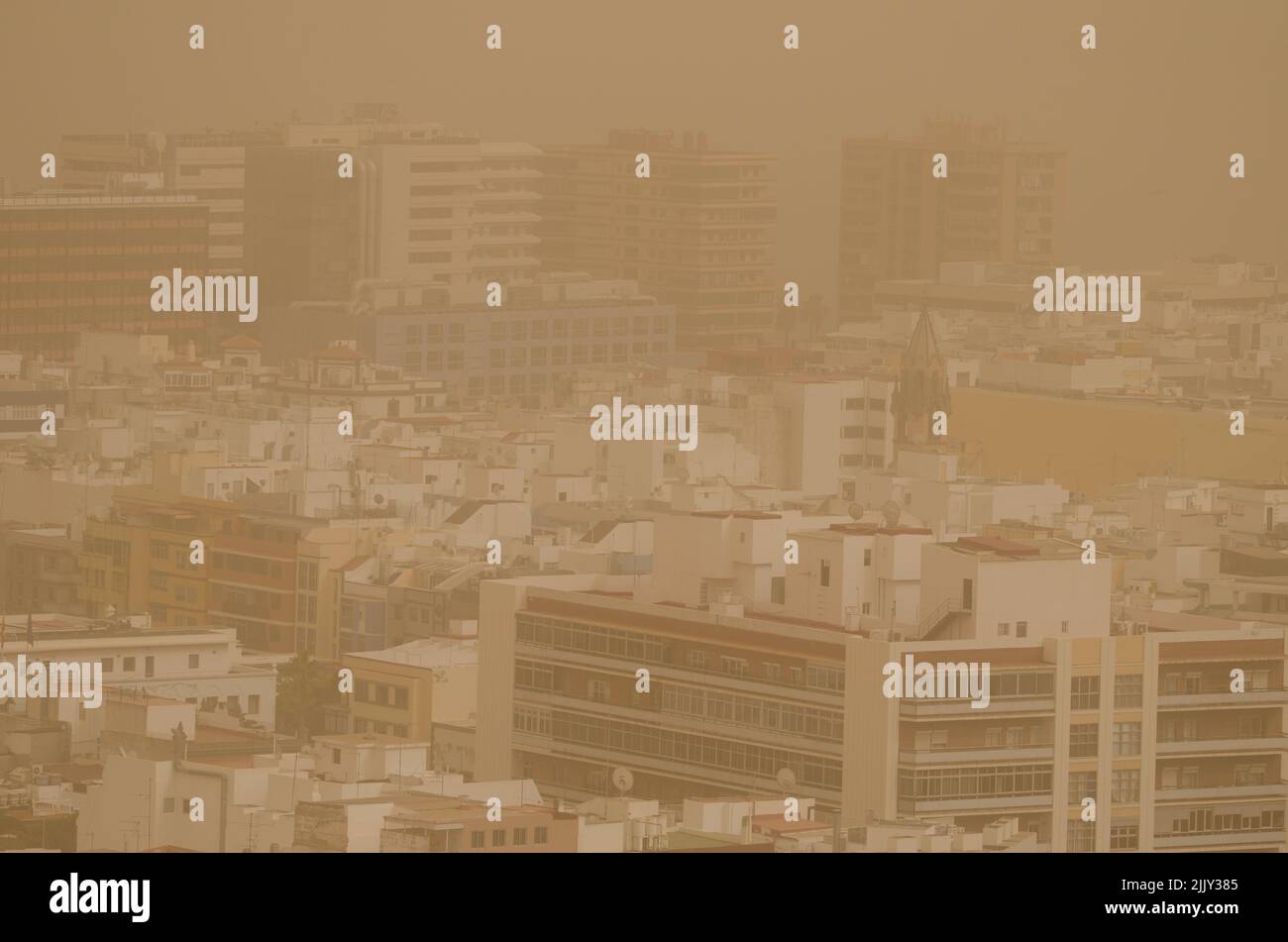City of Las Palmas de Gran Canaria under a dense haze formed by ...