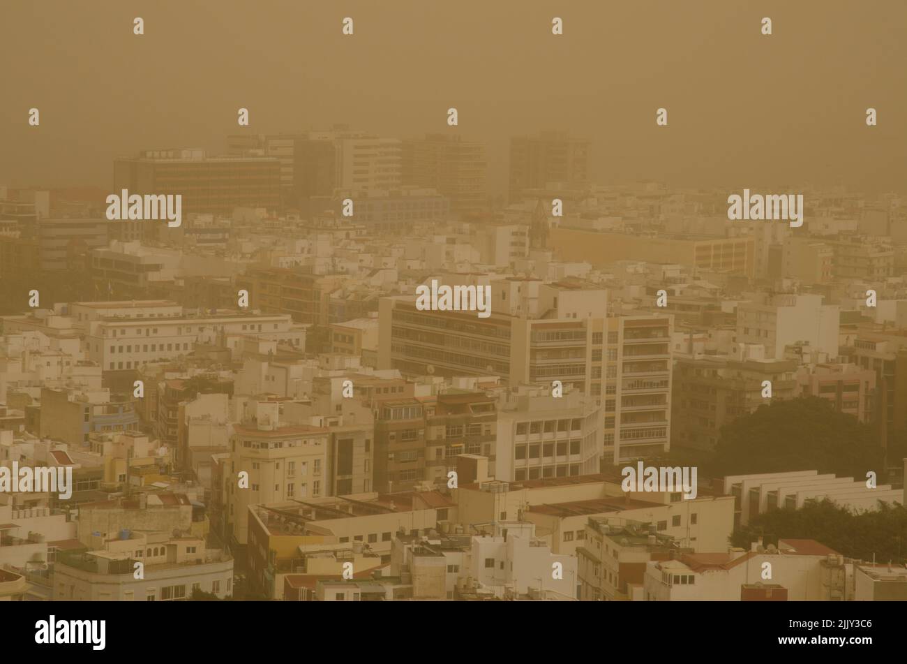 City of Las Palmas de Gran Canaria under a dense haze formed by ...