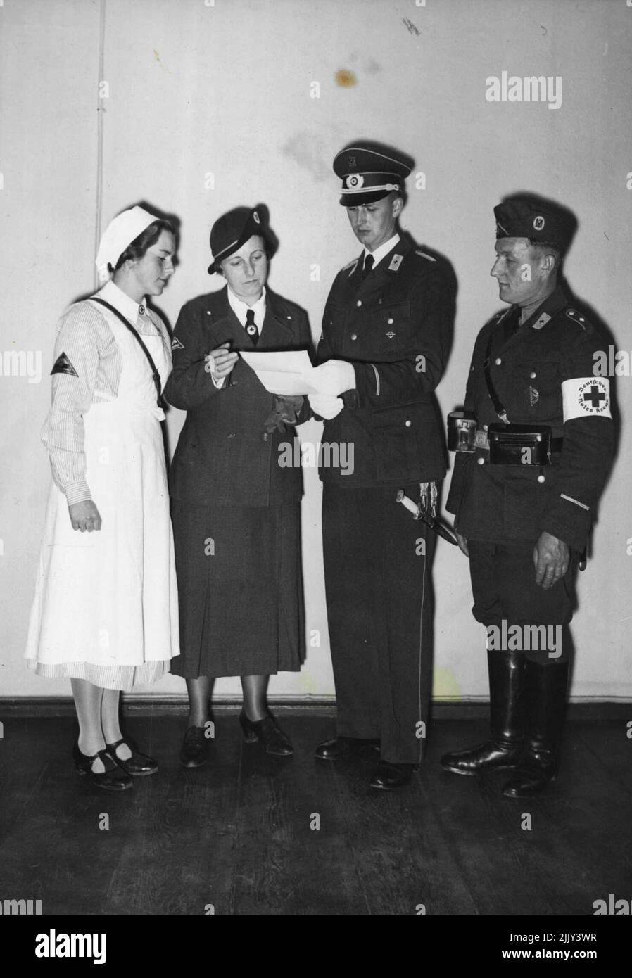 New Uniforms Of German Red Cross -- From right to left: Assistant ...