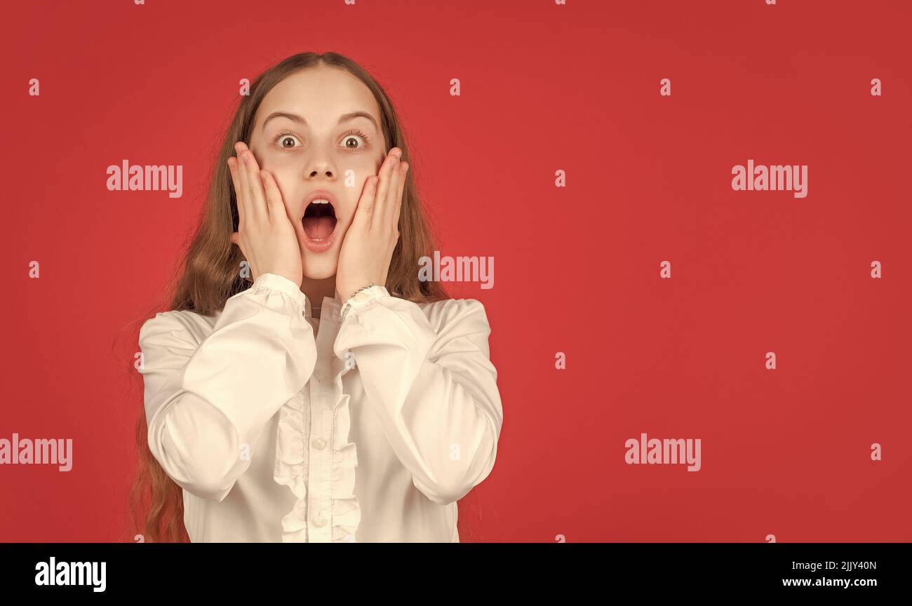 shocking news. kid in white shirt on red background. childhood ...