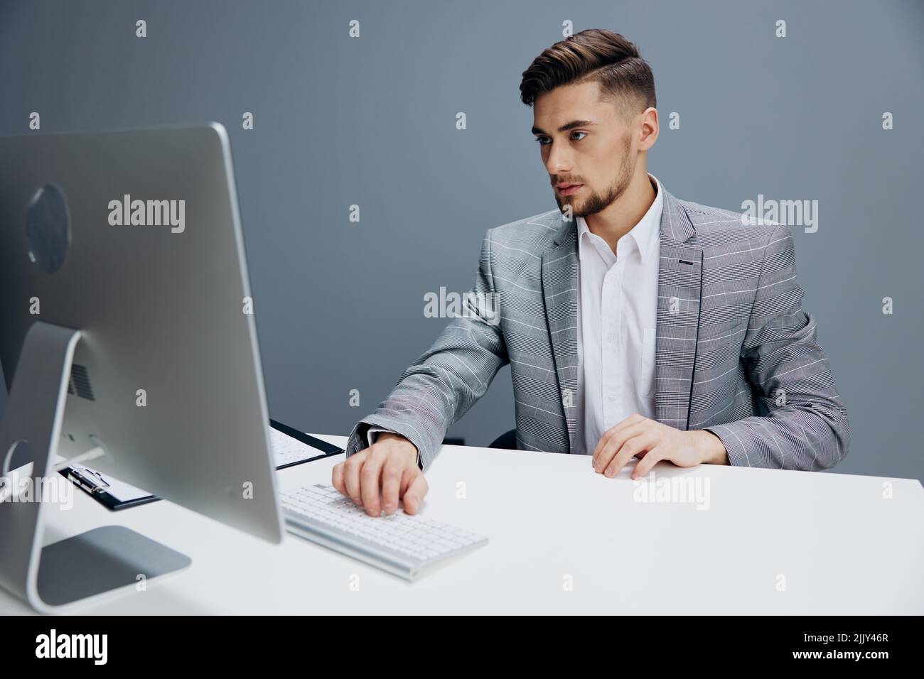 manager documents on the table computer work emotions executive Stock ...