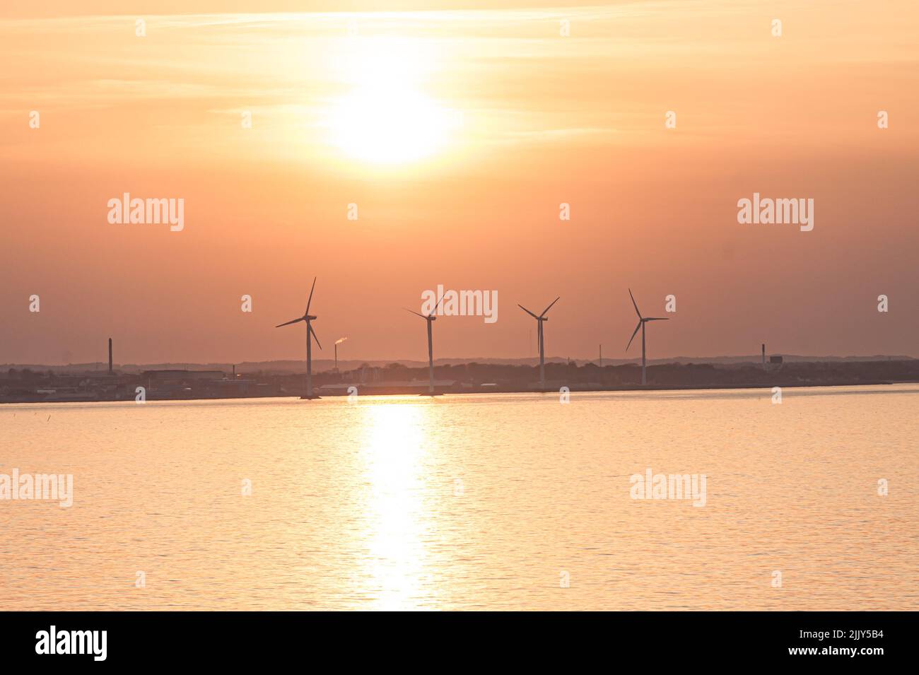 Sun setting over wind turbines hi-res stock photography and images - Alamy