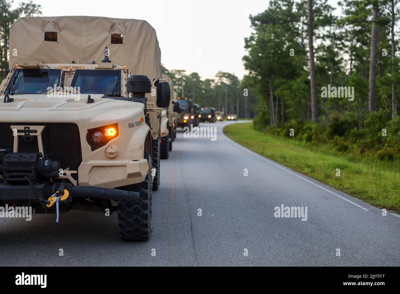 U.S. Marine Corps tactical vehicles convoy behind Marines with 8th ...