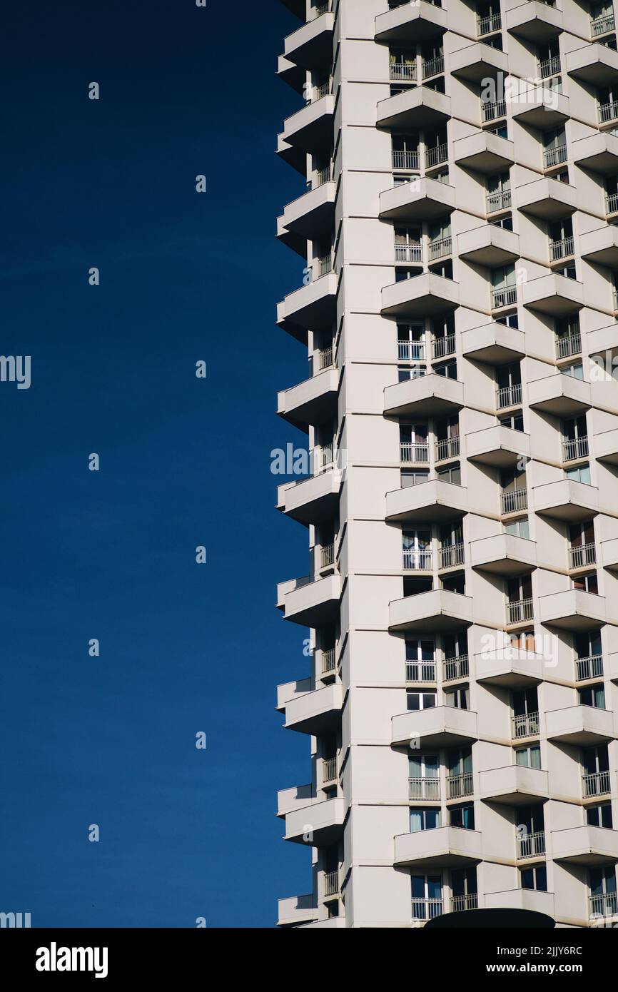 An exterior of a high-rise residential building against blue sky Stock ...