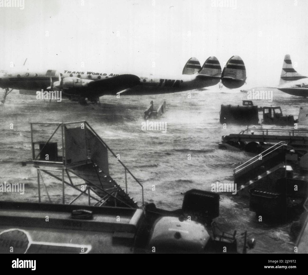 Storm Knocks Out LaGuardia Field - Wind-lashed rain and the waters of ...