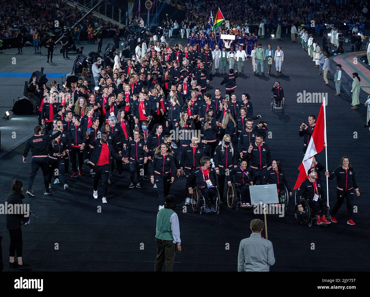 Flag bearers weightlifter Maude Charron, right., and wheelchair racer ...