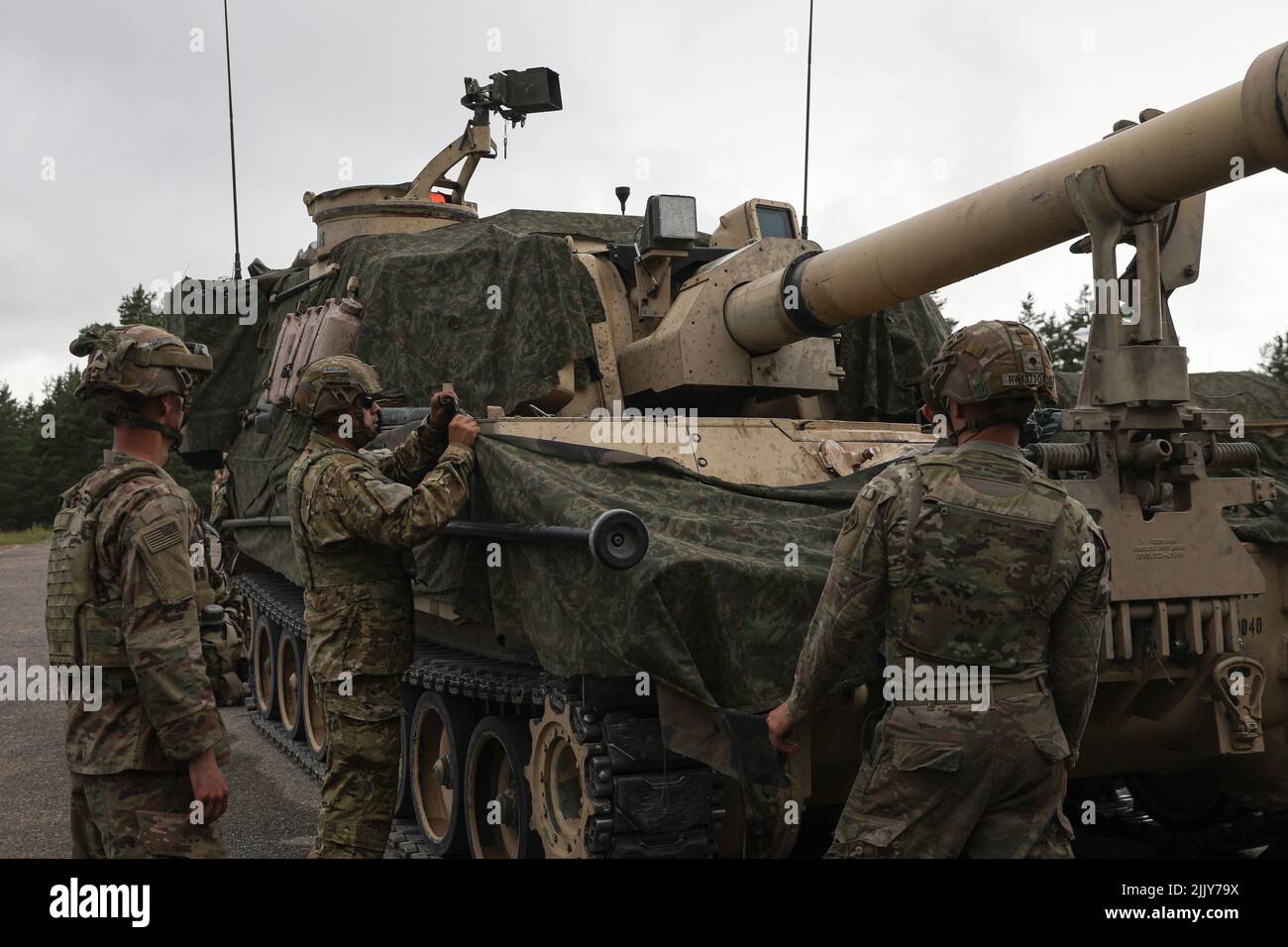 A U.S. Army artillery crew, assigned to Alpha Battery, 3rd Battalion ...