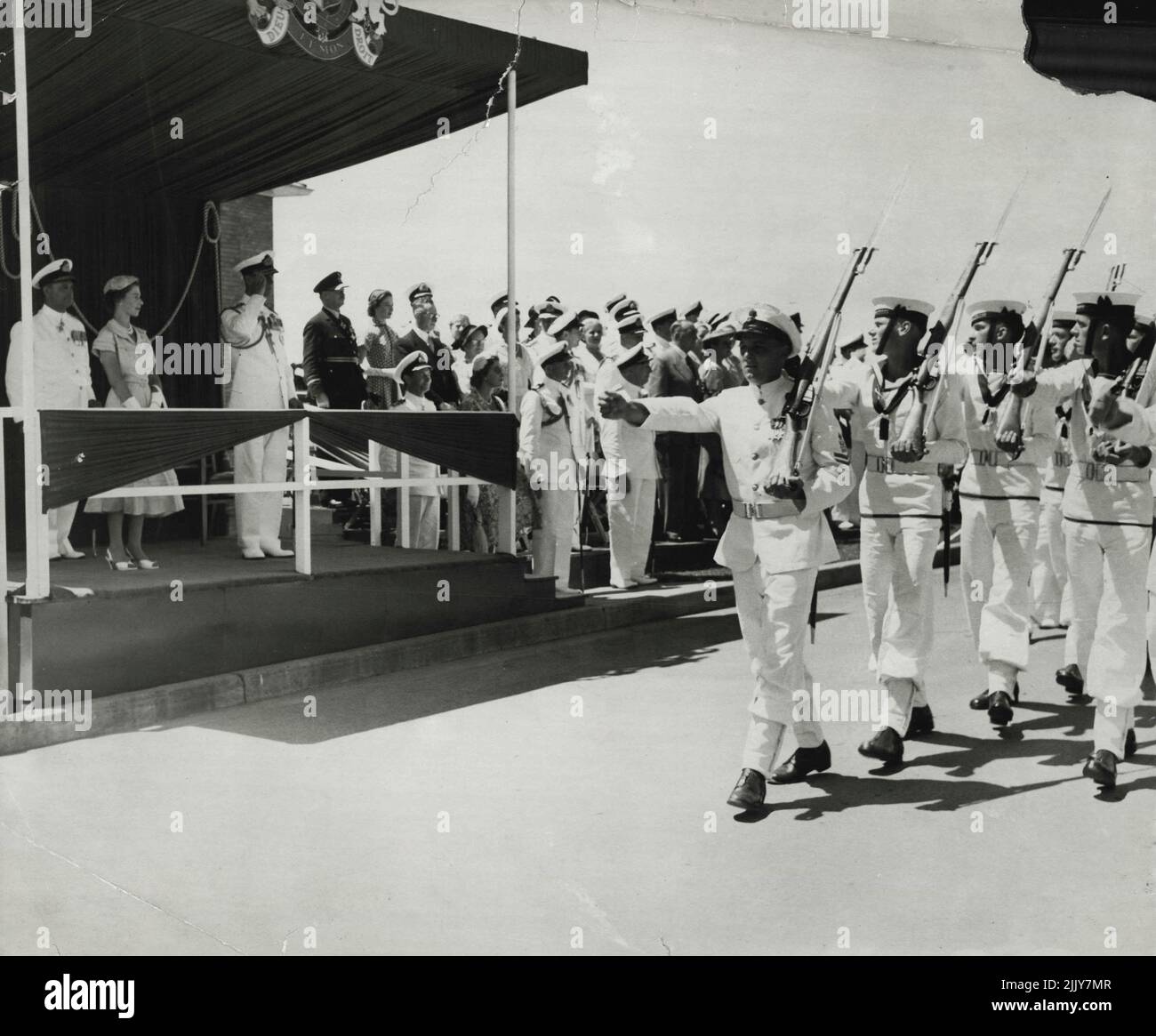 Salute Duke of Edinburgh salutes a march-past of naval ratings at ...