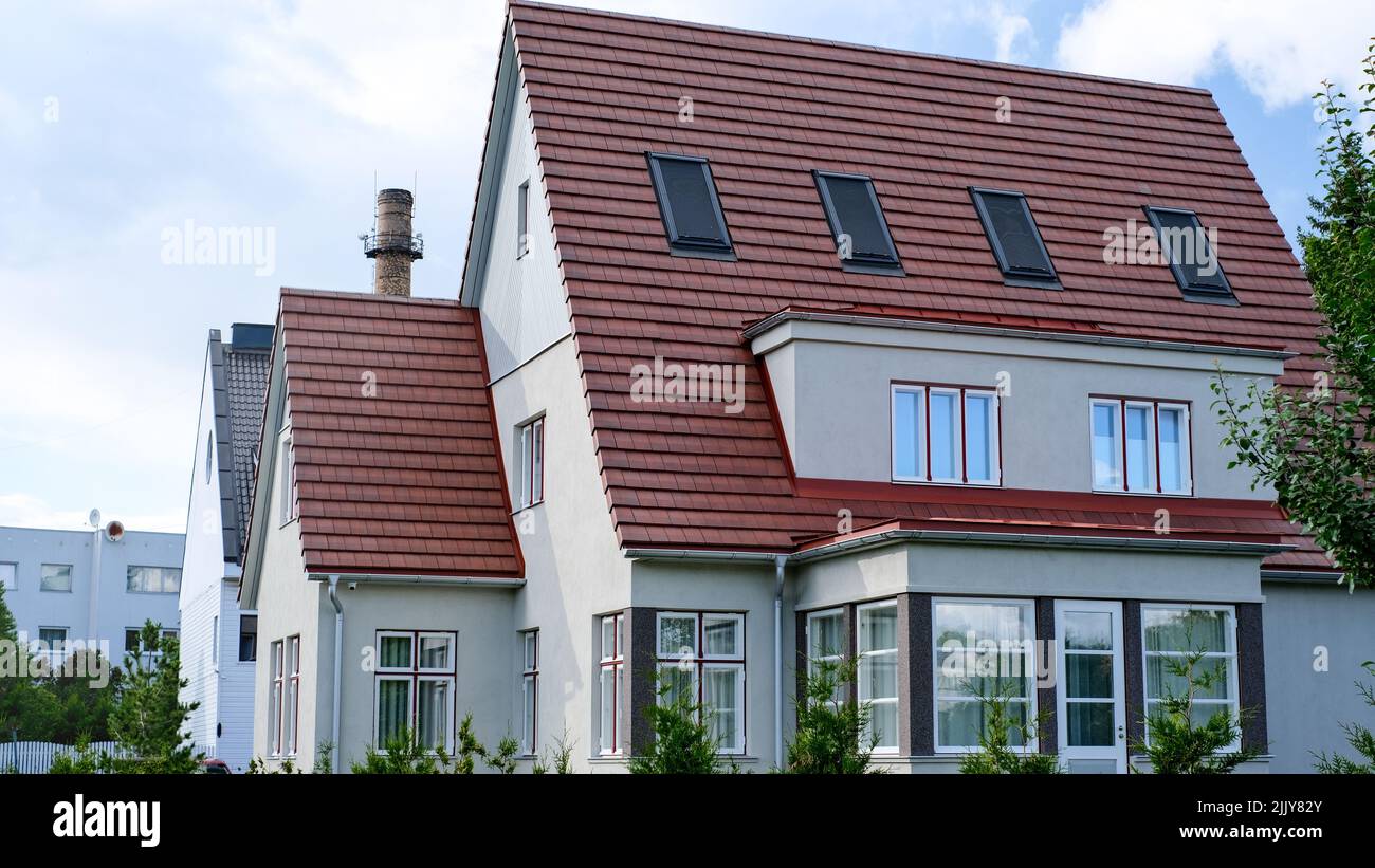 A private house of two floors with triangular roof and an area near the ...