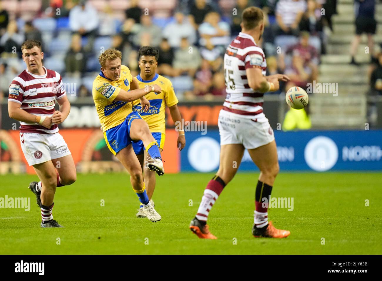 Jez Litten #14 of Hull KR kicks the ball up field Stock Photo - Alamy