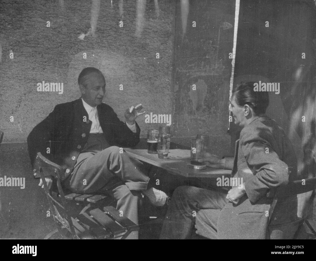 The author (right) talks with Fritz Lehr, former SS director of a ...
