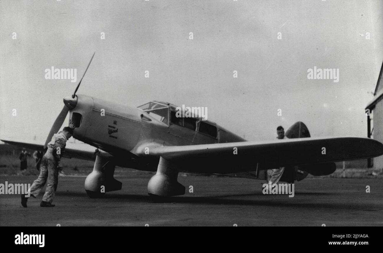 Mechanics giving Miss Jean Batten's plane a final inspection just ...