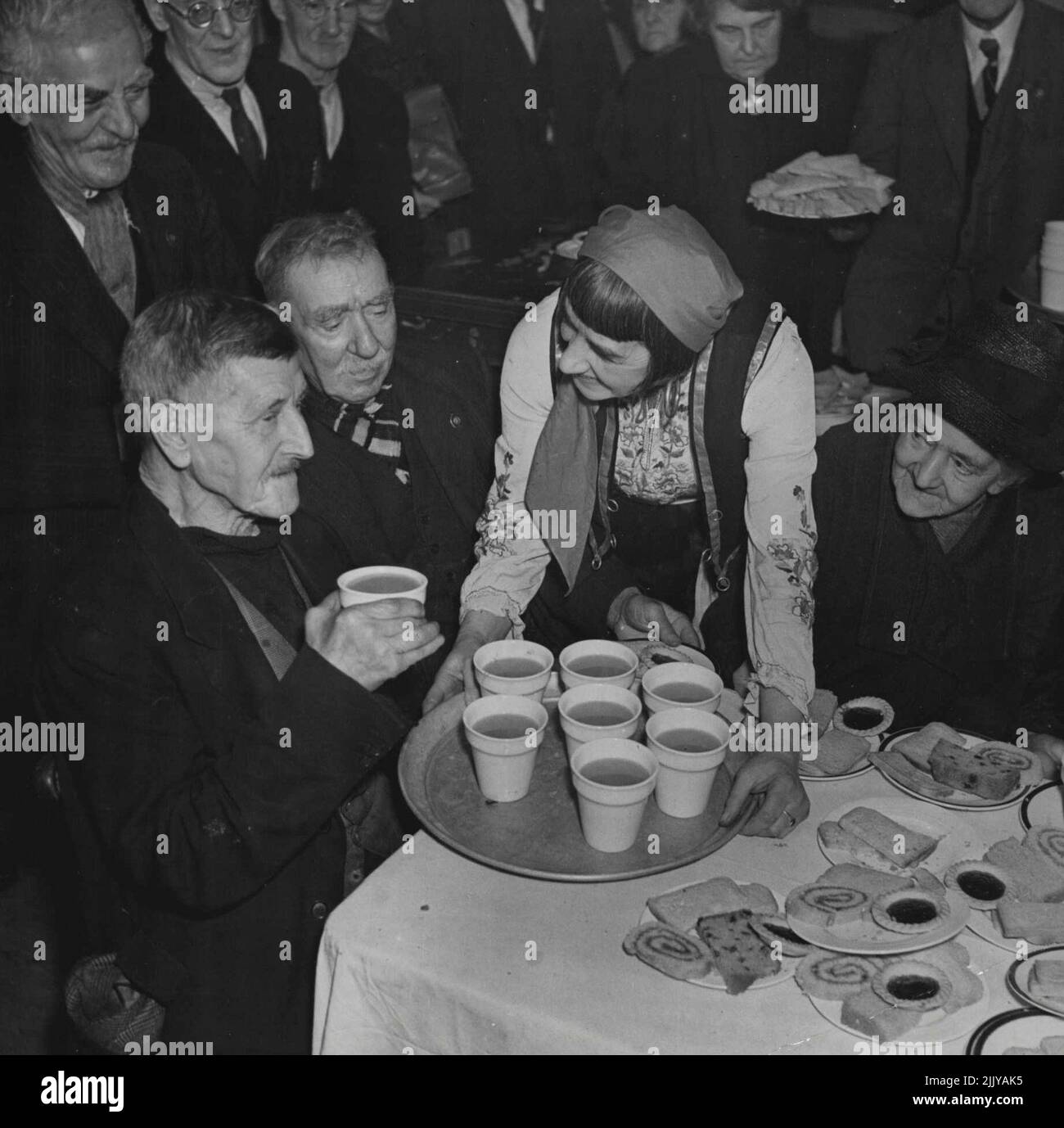 "Another Cup of tea, Sir? gypsy entertainer asks old man. Note ...