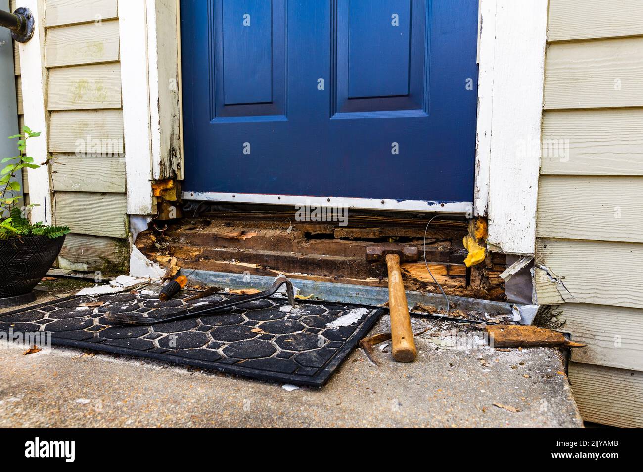 Damaged wood frame of door being repaired Stock Photo - Alamy