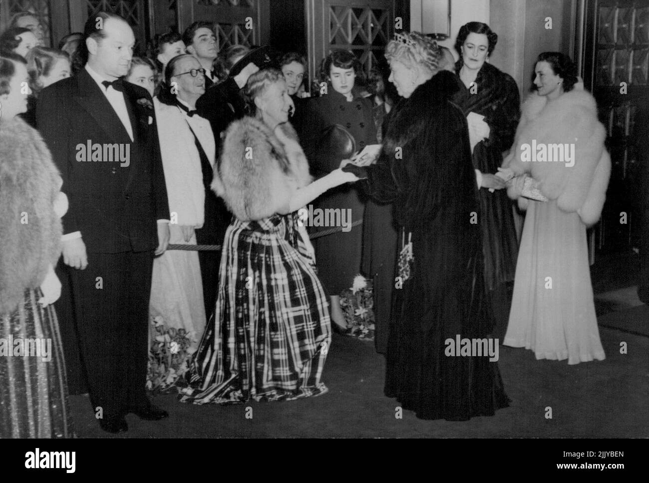 Queen Mary At Film Premiere -- H.M. Queen Mary shaking hands with Mrs ...
