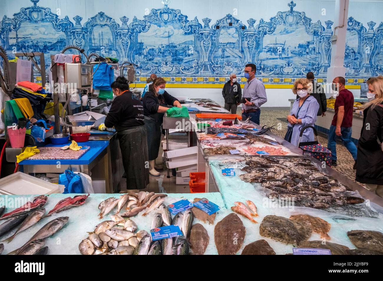 People buying fresh fish at the city market in Setúbal, Portugal Stock ...