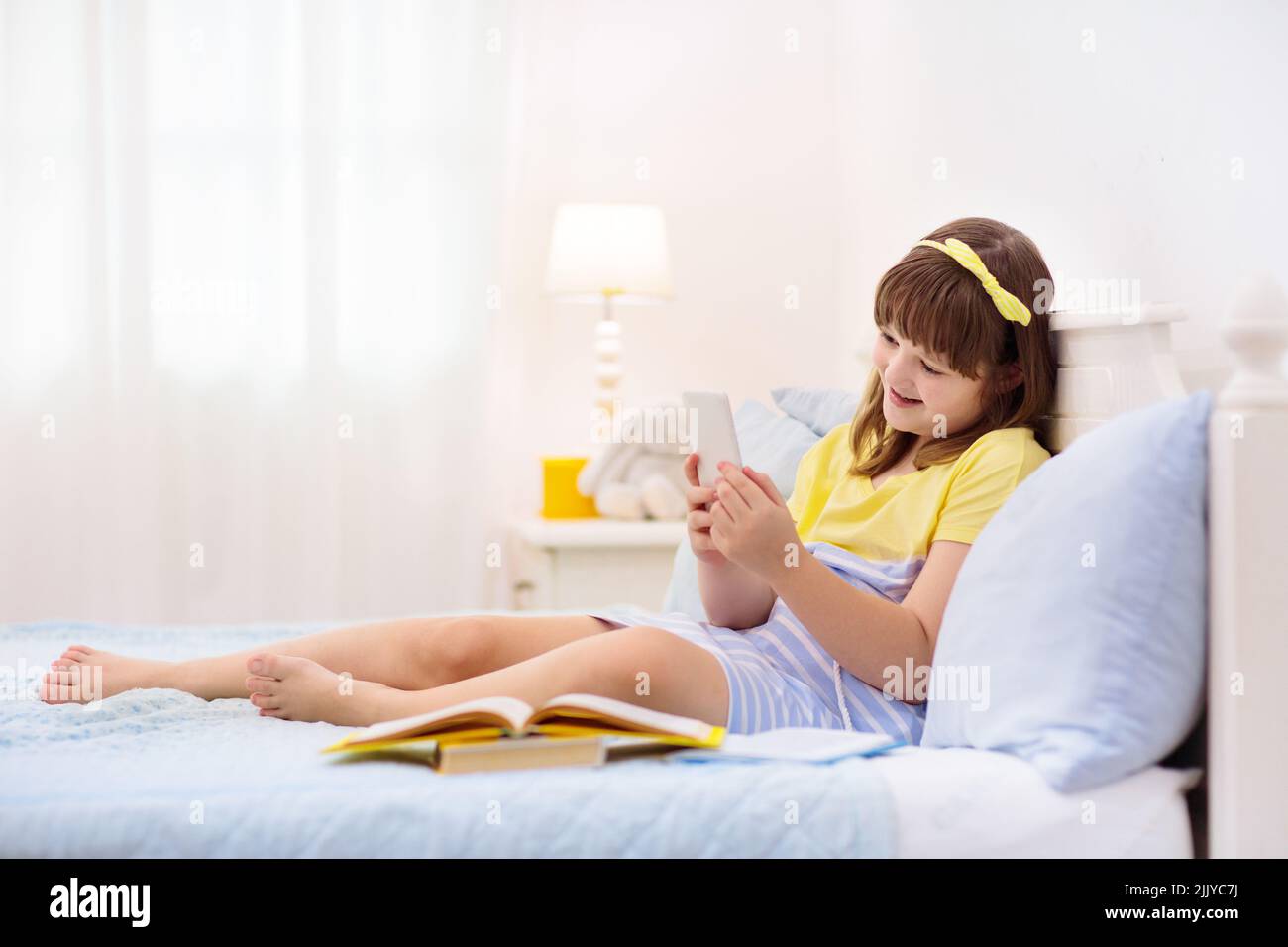 Teenager girl with smart phone. Teen kid texting and playing online ...