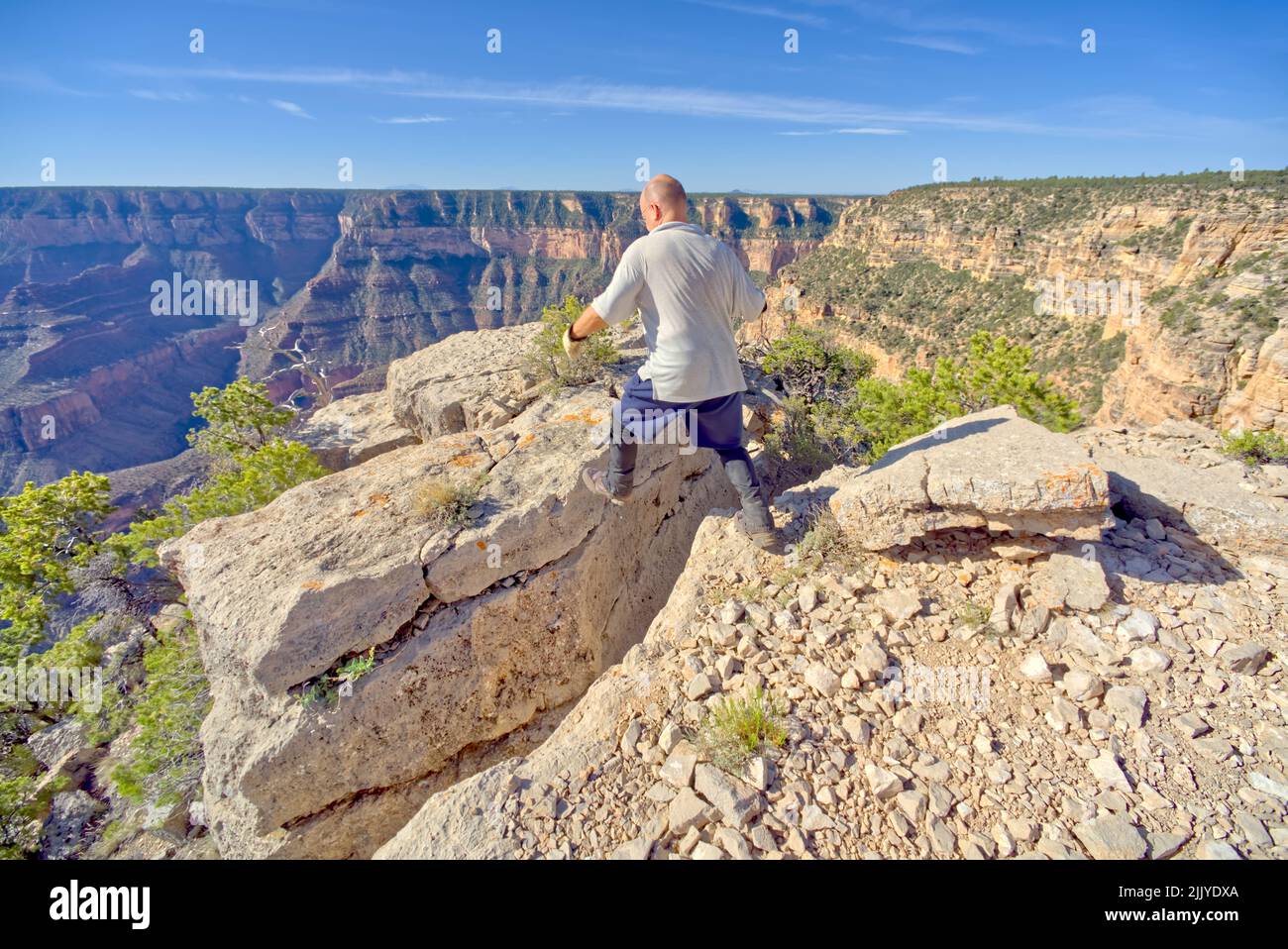 Jumping across canyon hi-res stock photography and images - Alamy