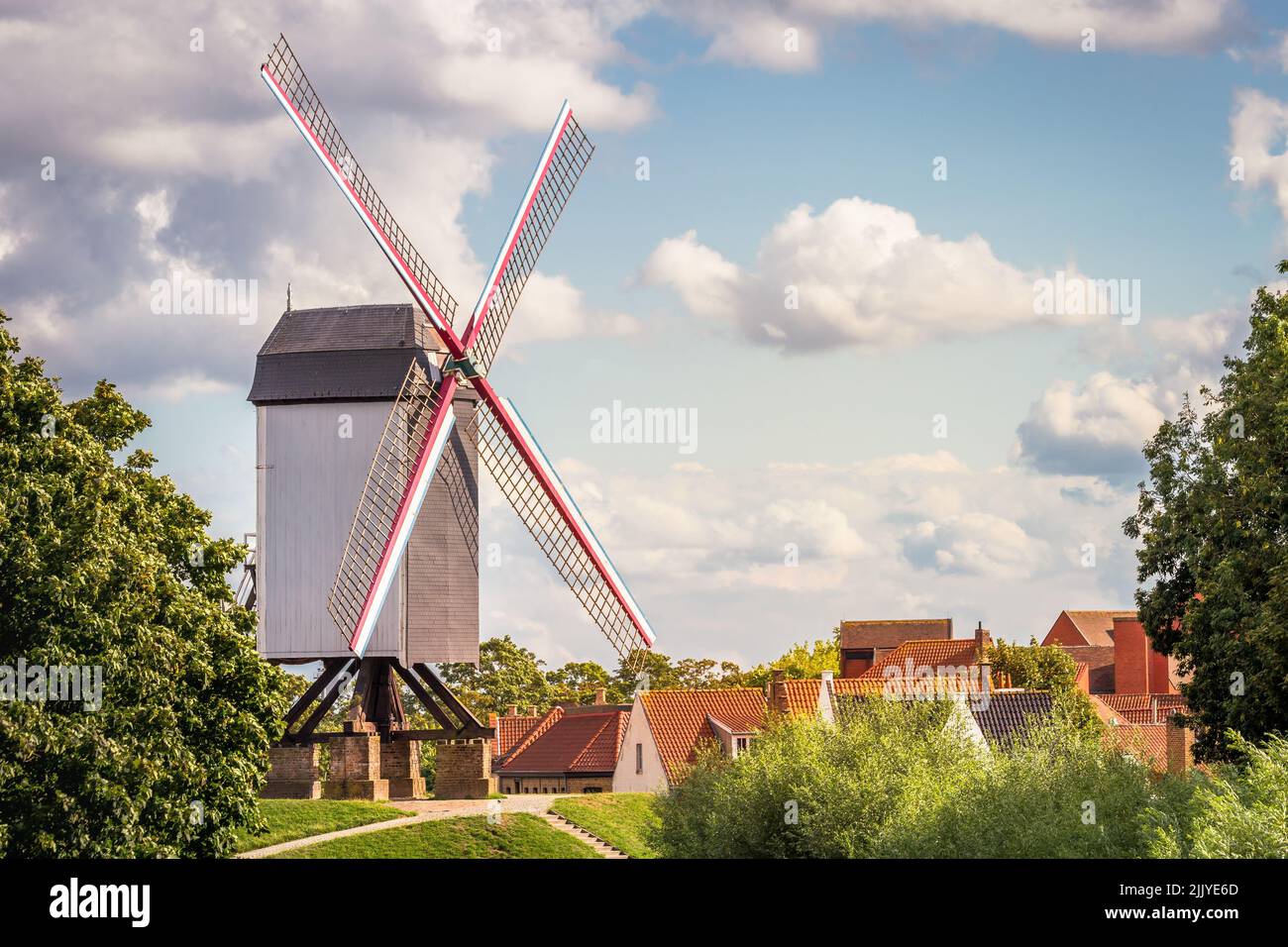 Rustic wooden windmills in idyllic Bruges public park, Belgium Stock ...