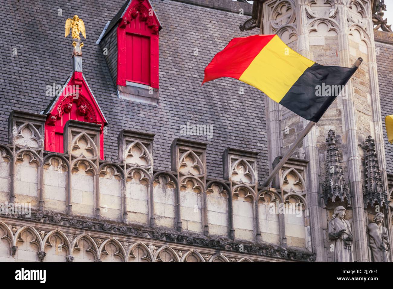 Belgian flags, flemish architecture in Bruges market square Stock Photo ...