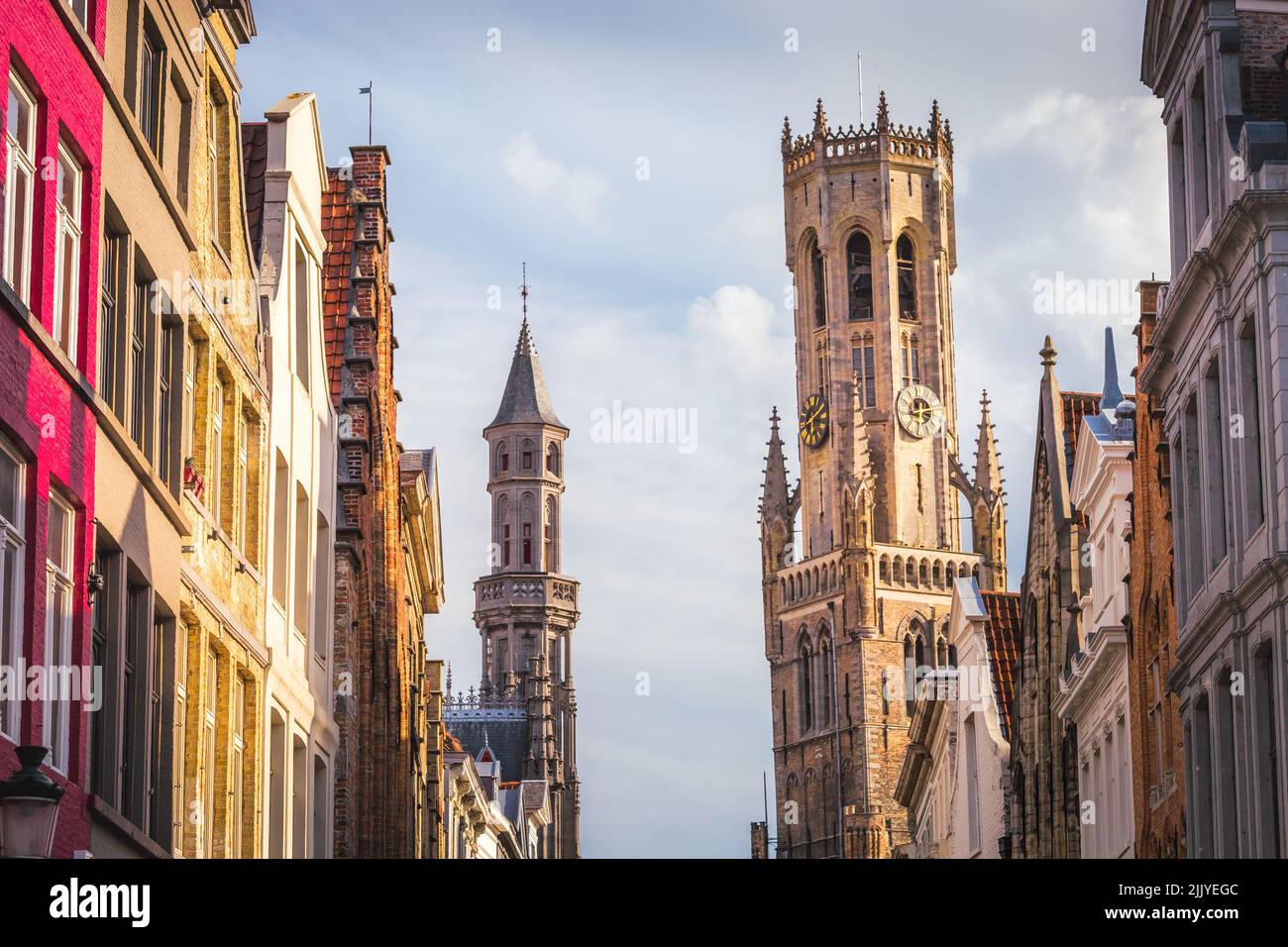 Belfry tower and flemish architecture in Bruges at sunny day, Belgium ...