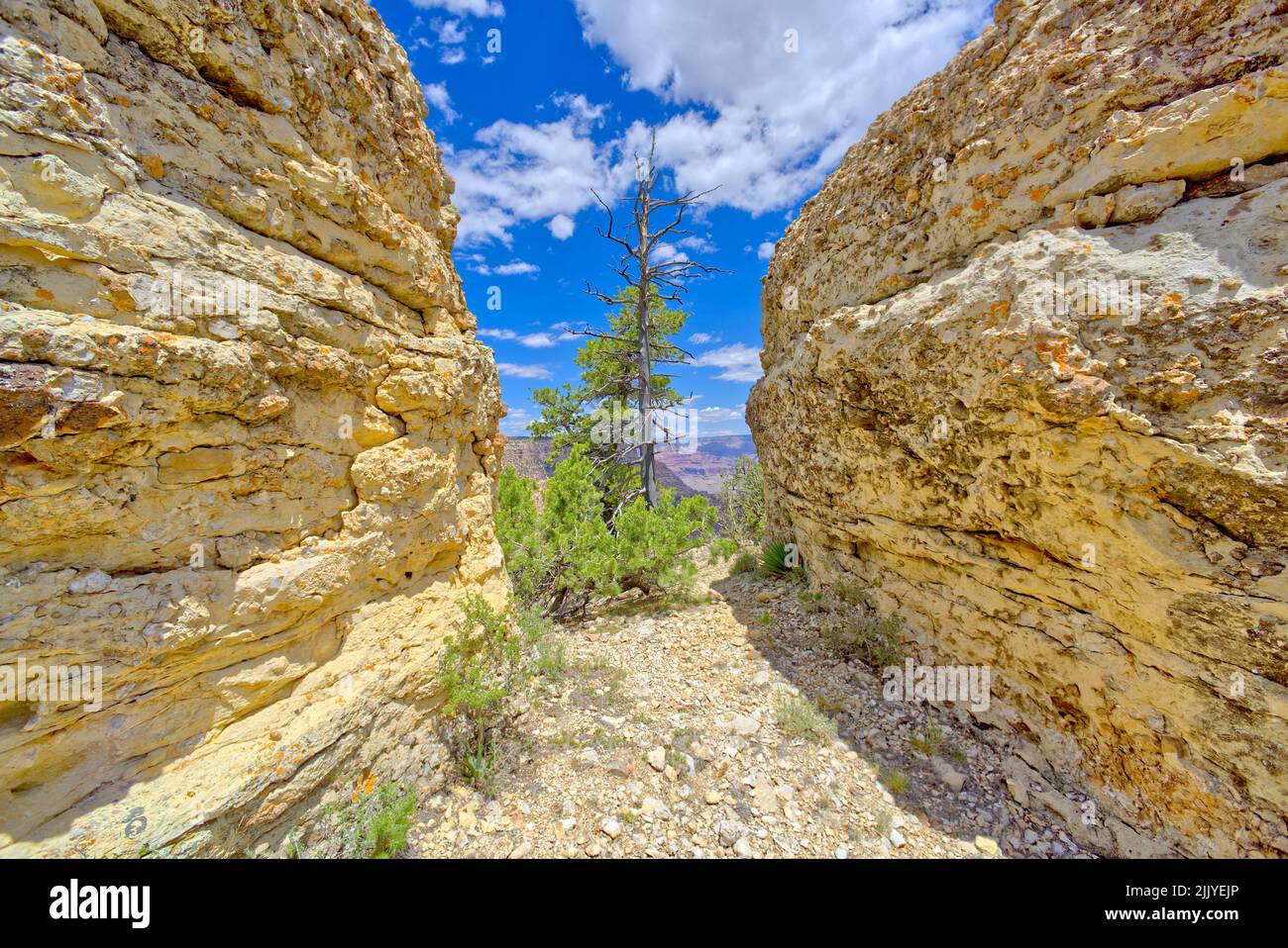 Grand Canyon Arizona viewed through a rocky passage on a cliff west of ...