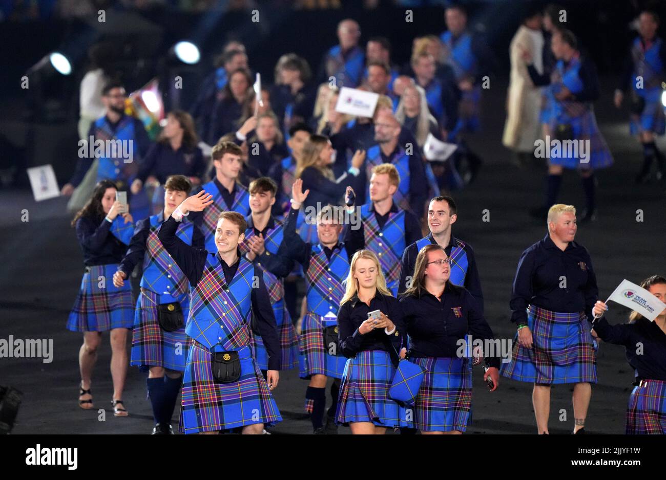 Scotland athletes wave as they enter the stadium during the opening ...