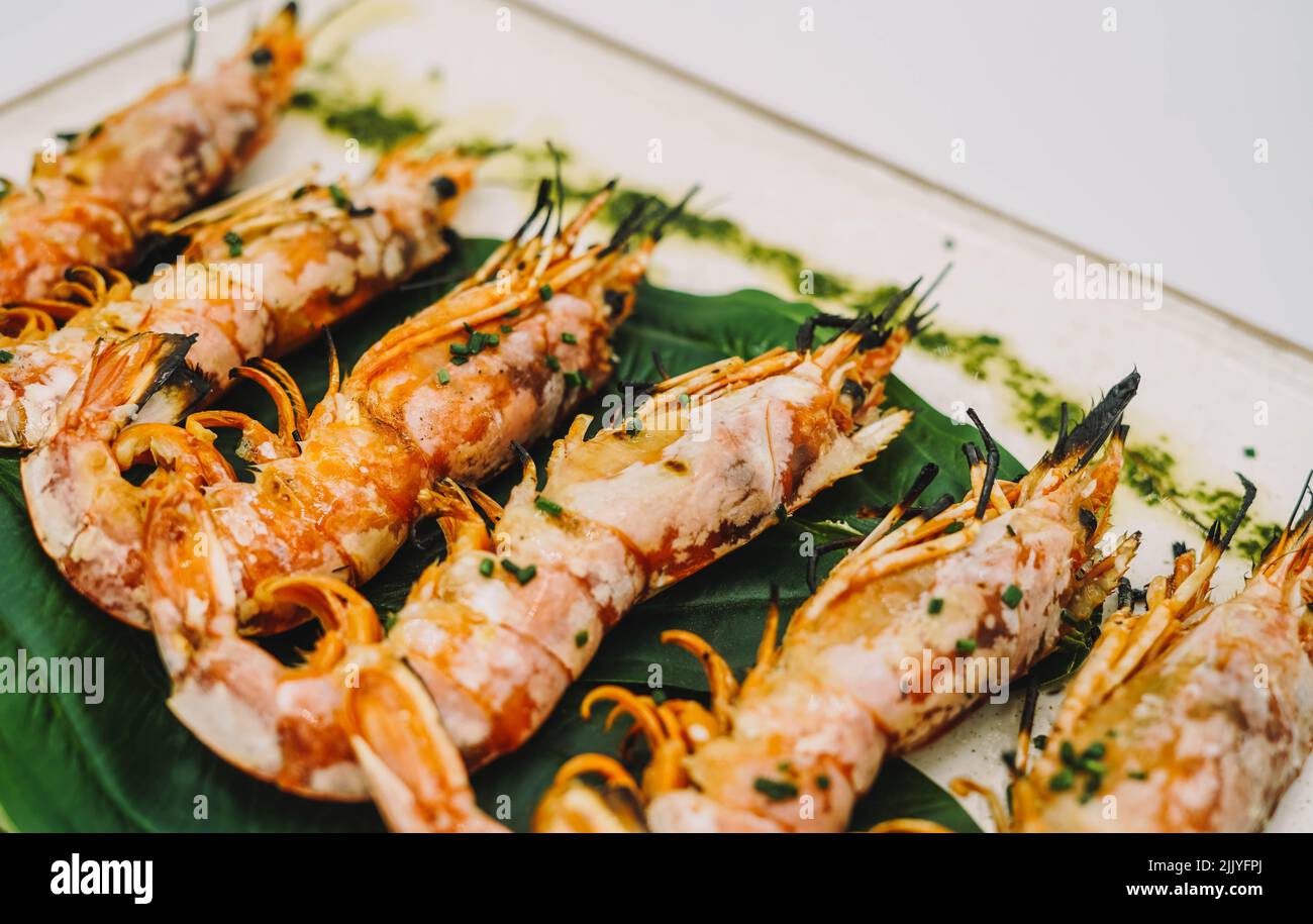 A gourmet portion of grilled prawns Stock Photo - Alamy
