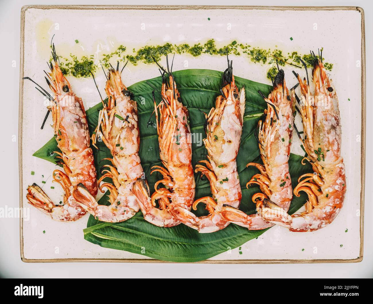 A gourmet portion of grilled prawns Stock Photo - Alamy