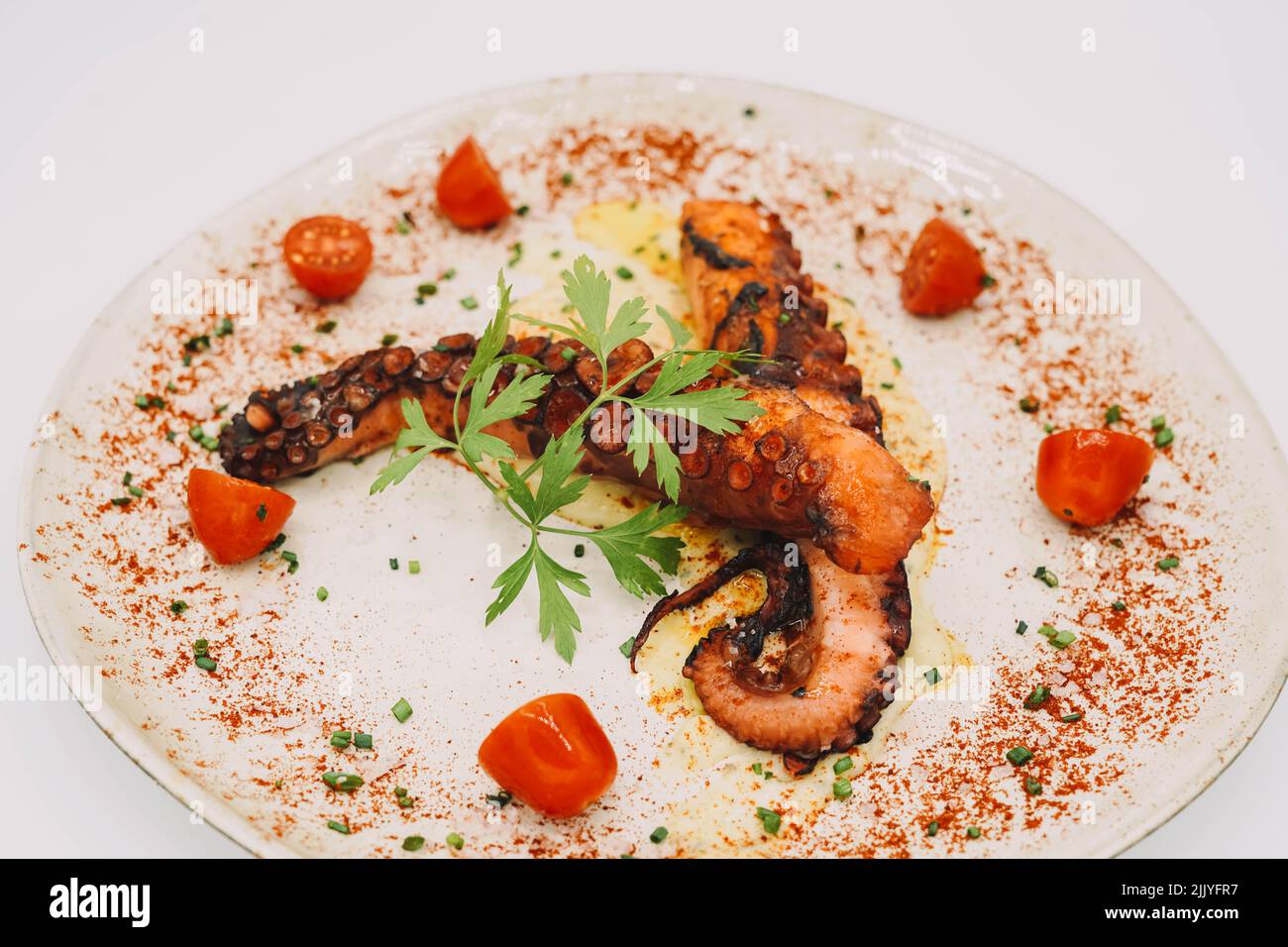 An excellent gourmet dish of Galician octopus Stock Photo - Alamy