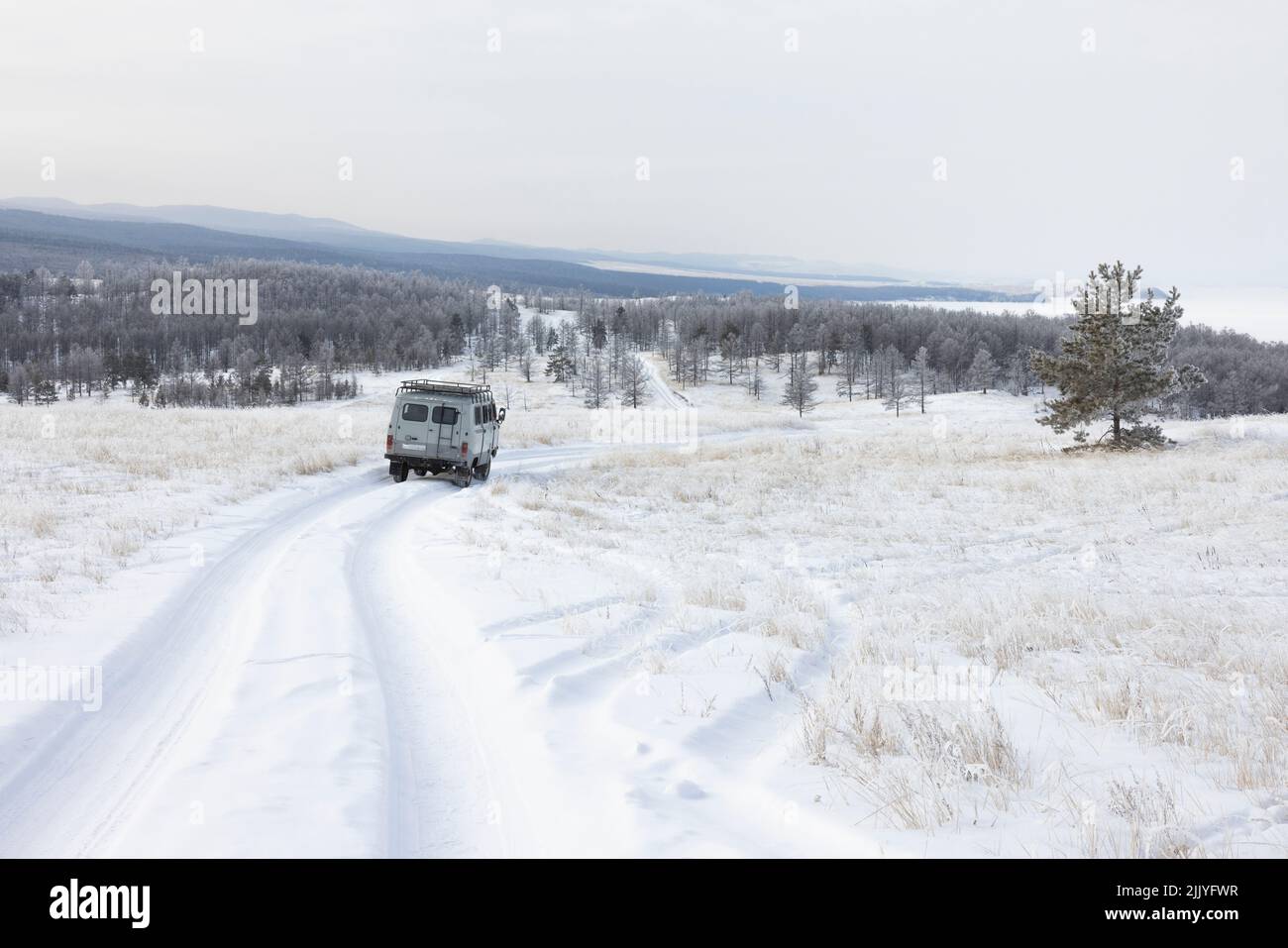 van going down over frozen road Stock Photo - Alamy