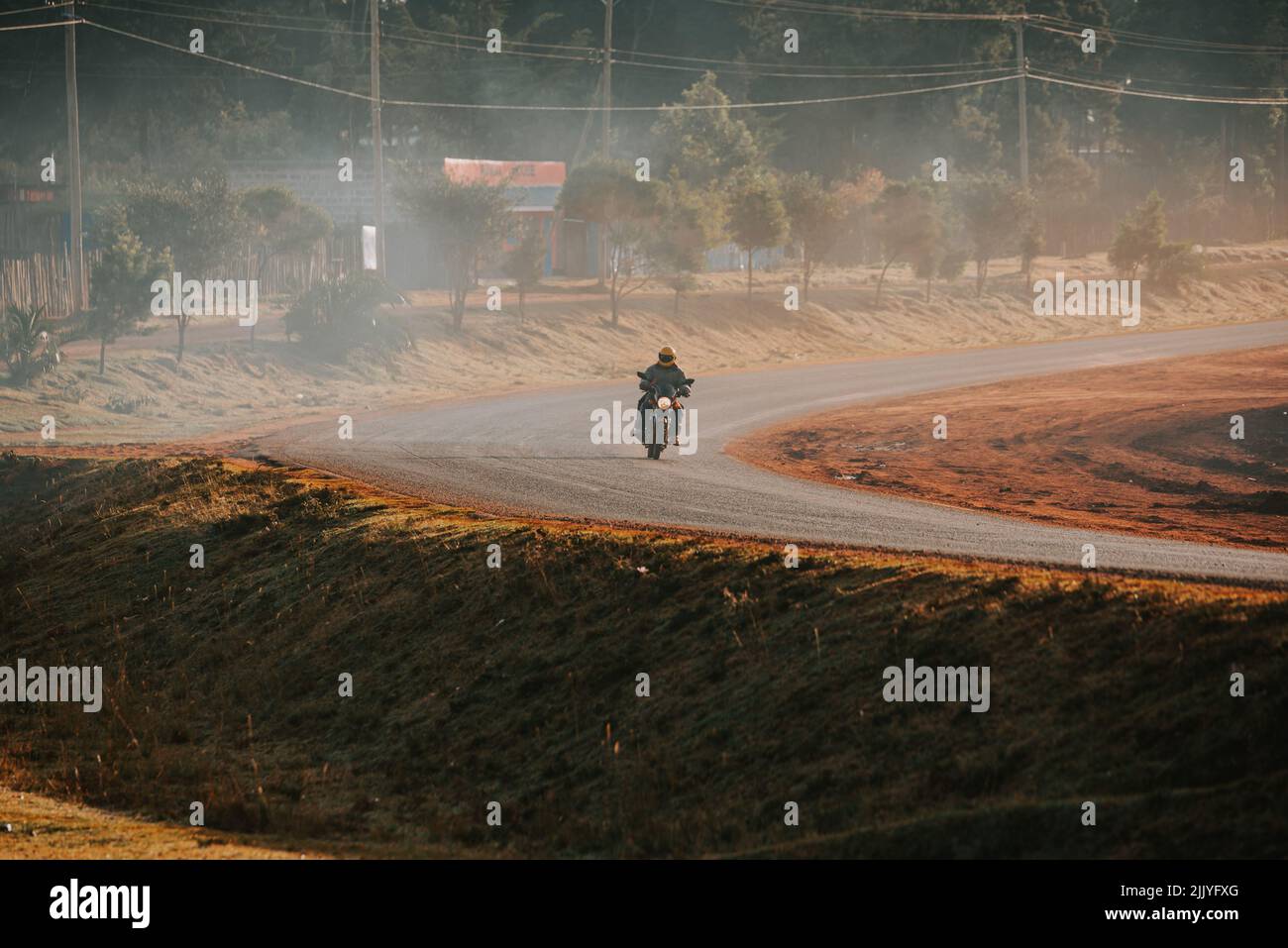 Motorcycle rider on the road in Kenya, Africa. Transport in Africa ...