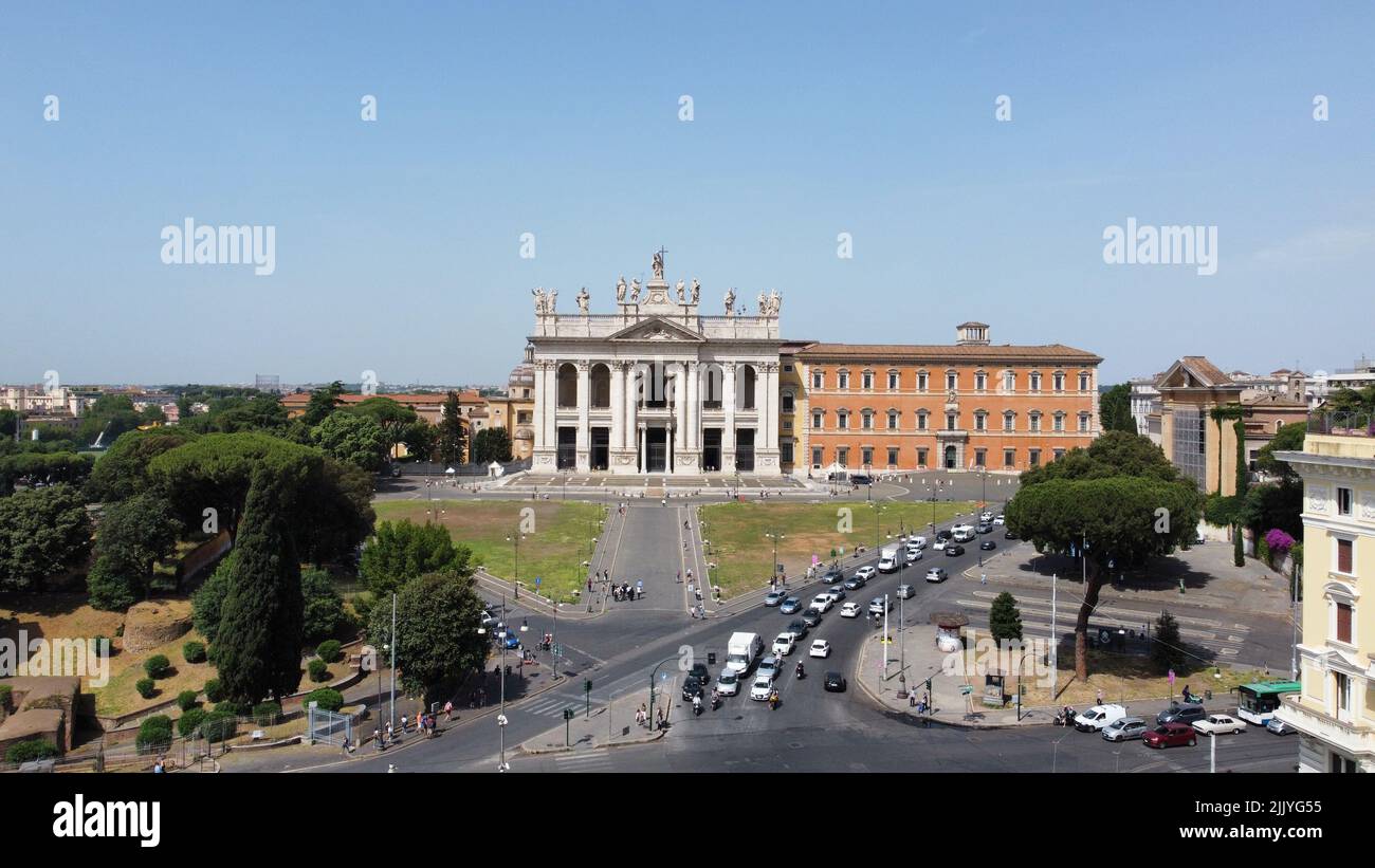 A panoramic view of Lateran Palace with front park, trees and cars on ...