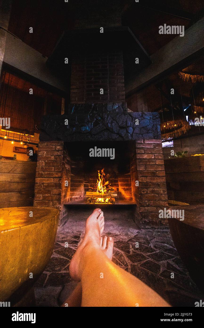 Person sitting by fire hi-res stock photography and images - Alamy