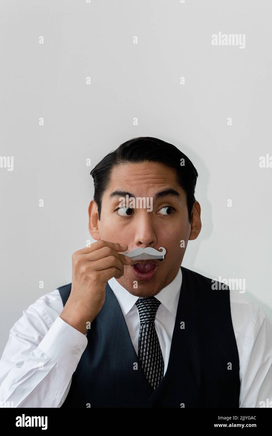 Latin man with mustache comic surprise face expression Stock Photo - Alamy
