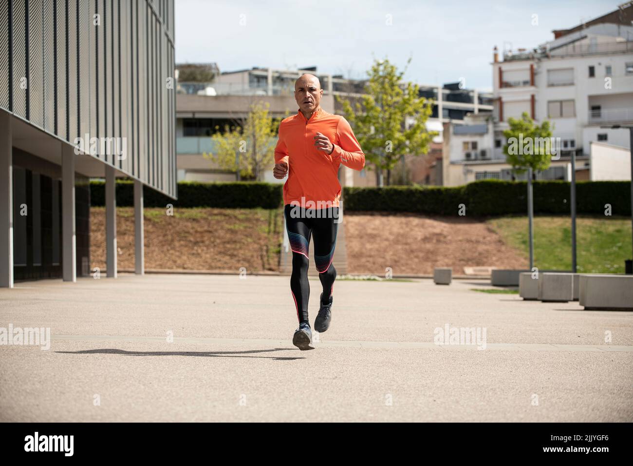 Bald man running hi-res stock photography and images - Alamy