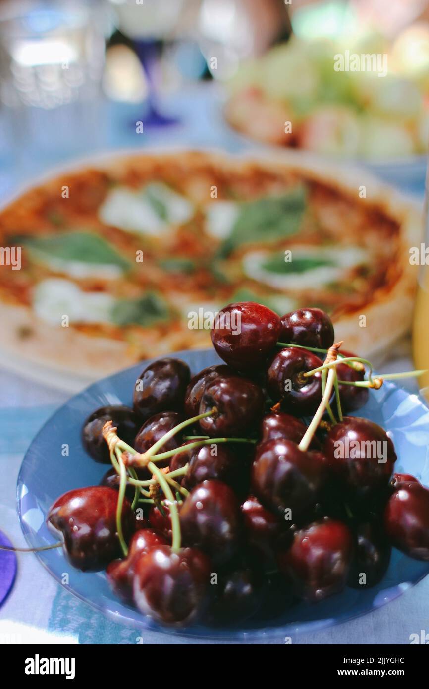 picnic with cherry and pizza Stock Photo - Alamy