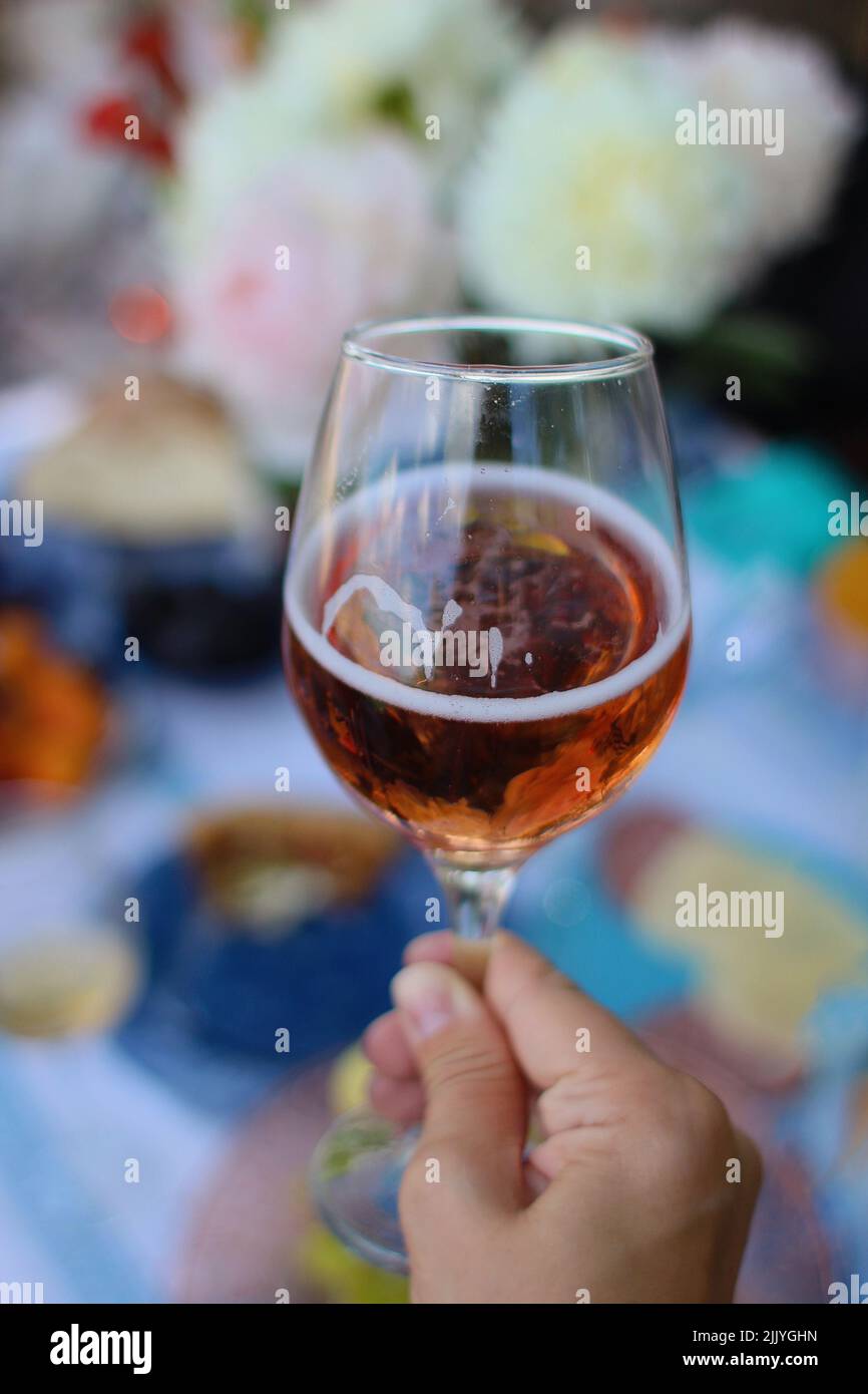 glass of wine in hand Stock Photo - Alamy