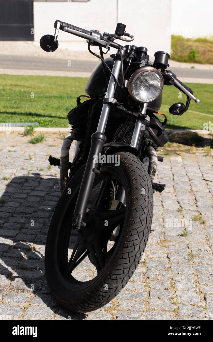 Black classic motorcycle on the city street Stock Photo - Alamy