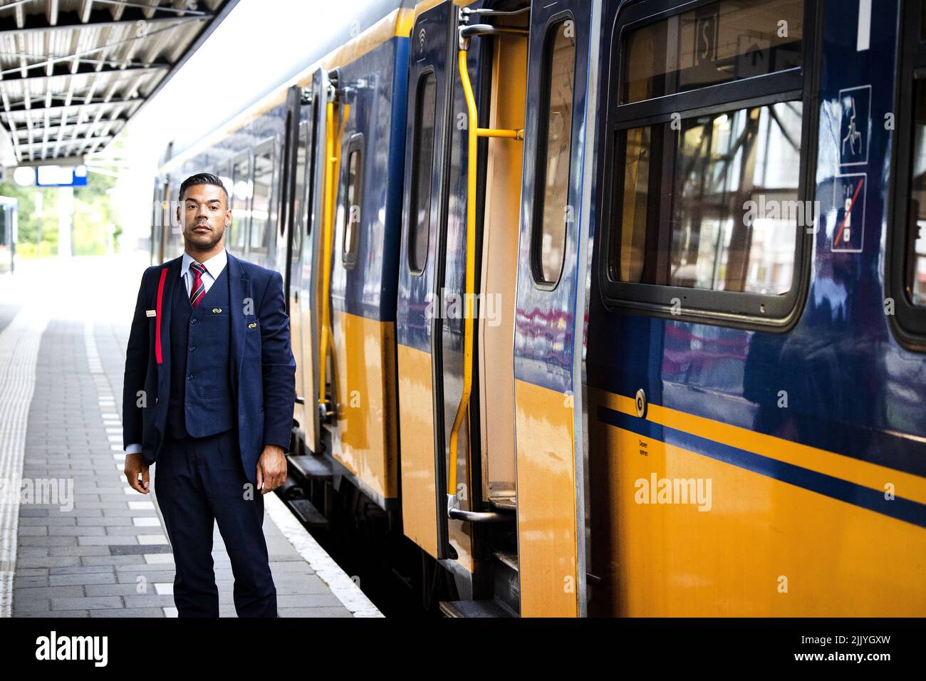 2022-07-28 20:52:15 UTRECHT - Conductors of the NS on a platform on the ...