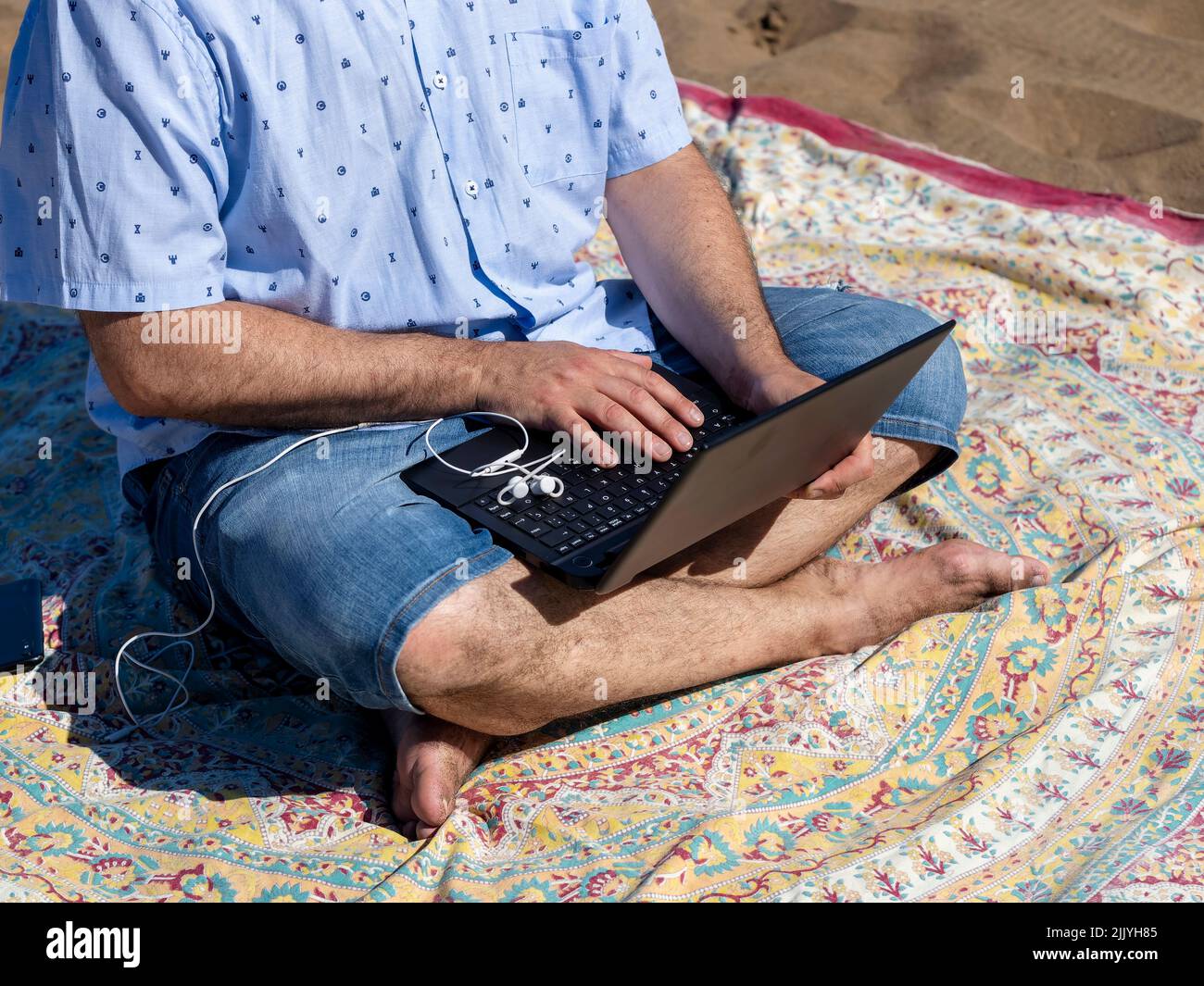 Man on vacation making a video call from the beach Stock Photo - Alamy