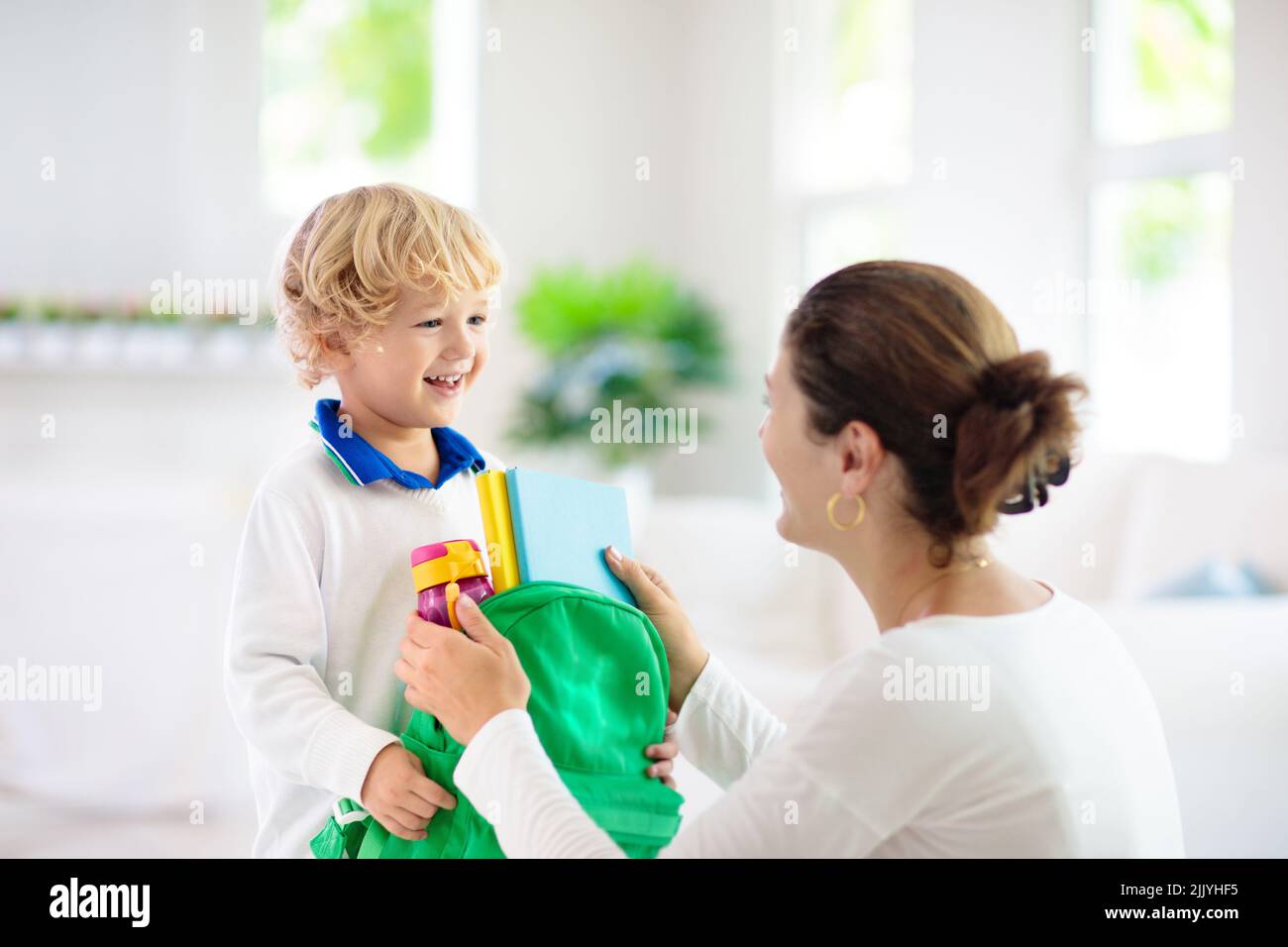 Child going back to school. Mother and kid getting ready for first ...