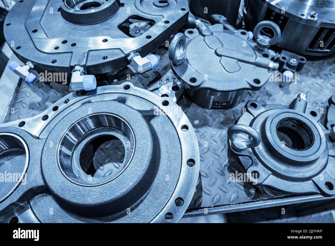 Spare parts concept. Close up metal parts of agricultural equipment ...