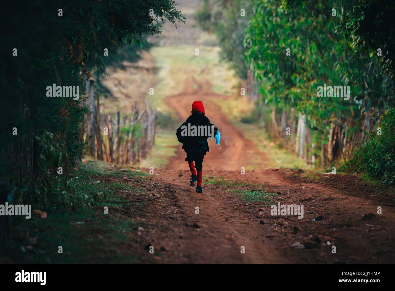 A small child from Africa walks to school. illustration photo for child ...