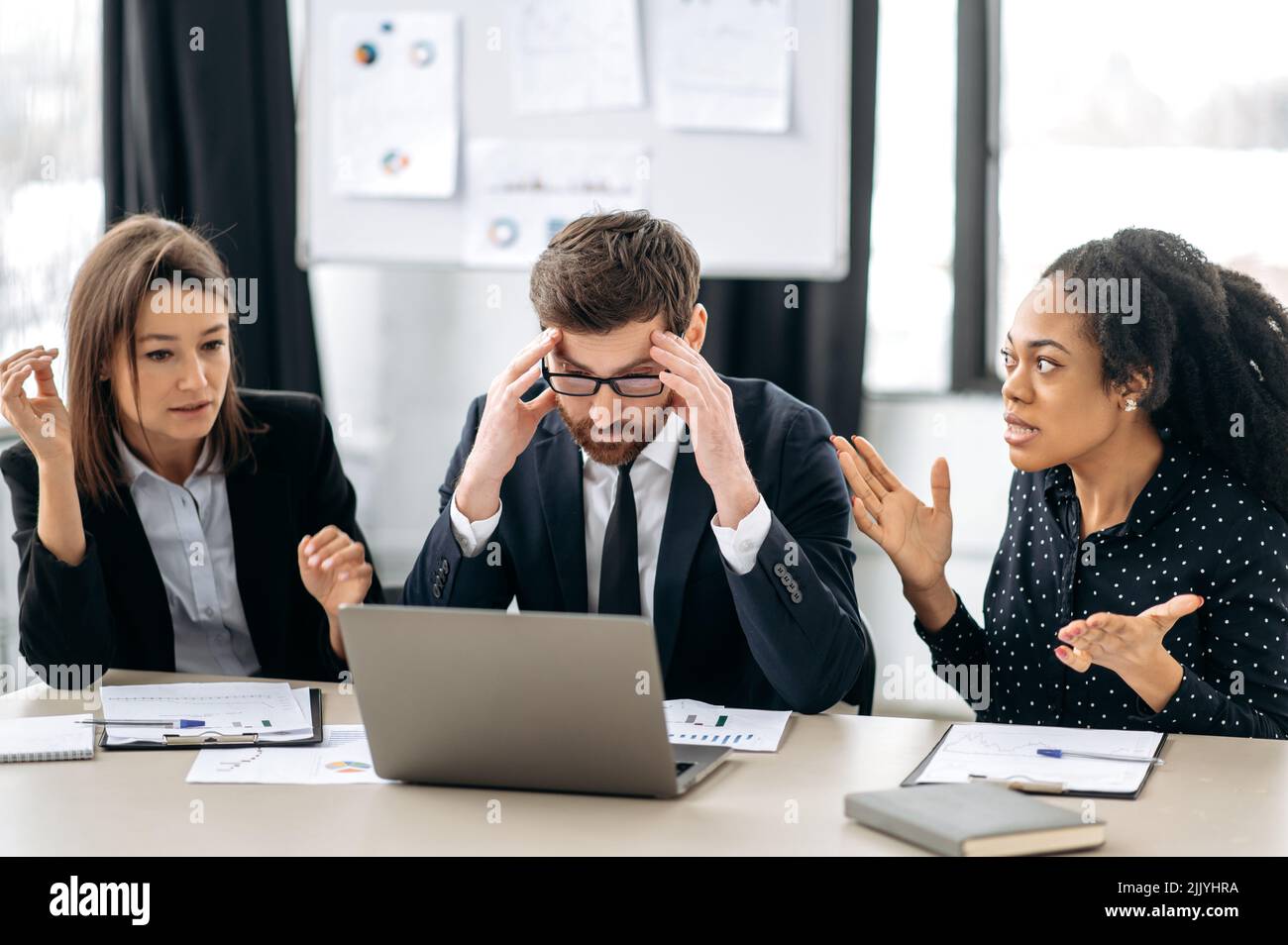 Annoyed business employees of different nationalities, work at the ...