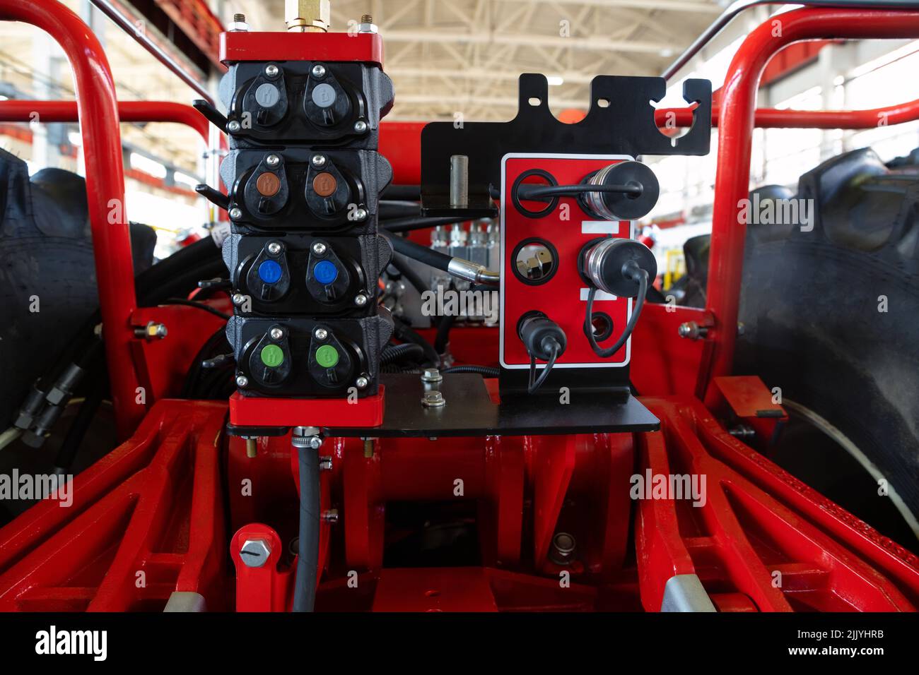 Close-up image of parts of new tractor at agricultural machinery plant ...