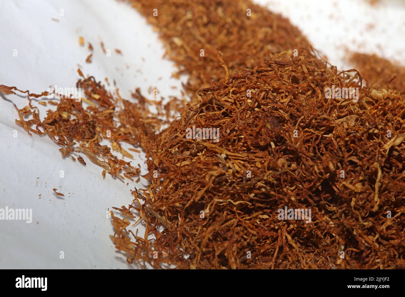 Smoking rolled tobacco leaves close up modern background high quality ...