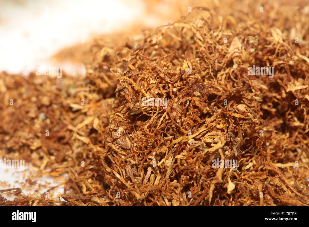 Smoking rolled tobacco leaves close up modern background high quality ...