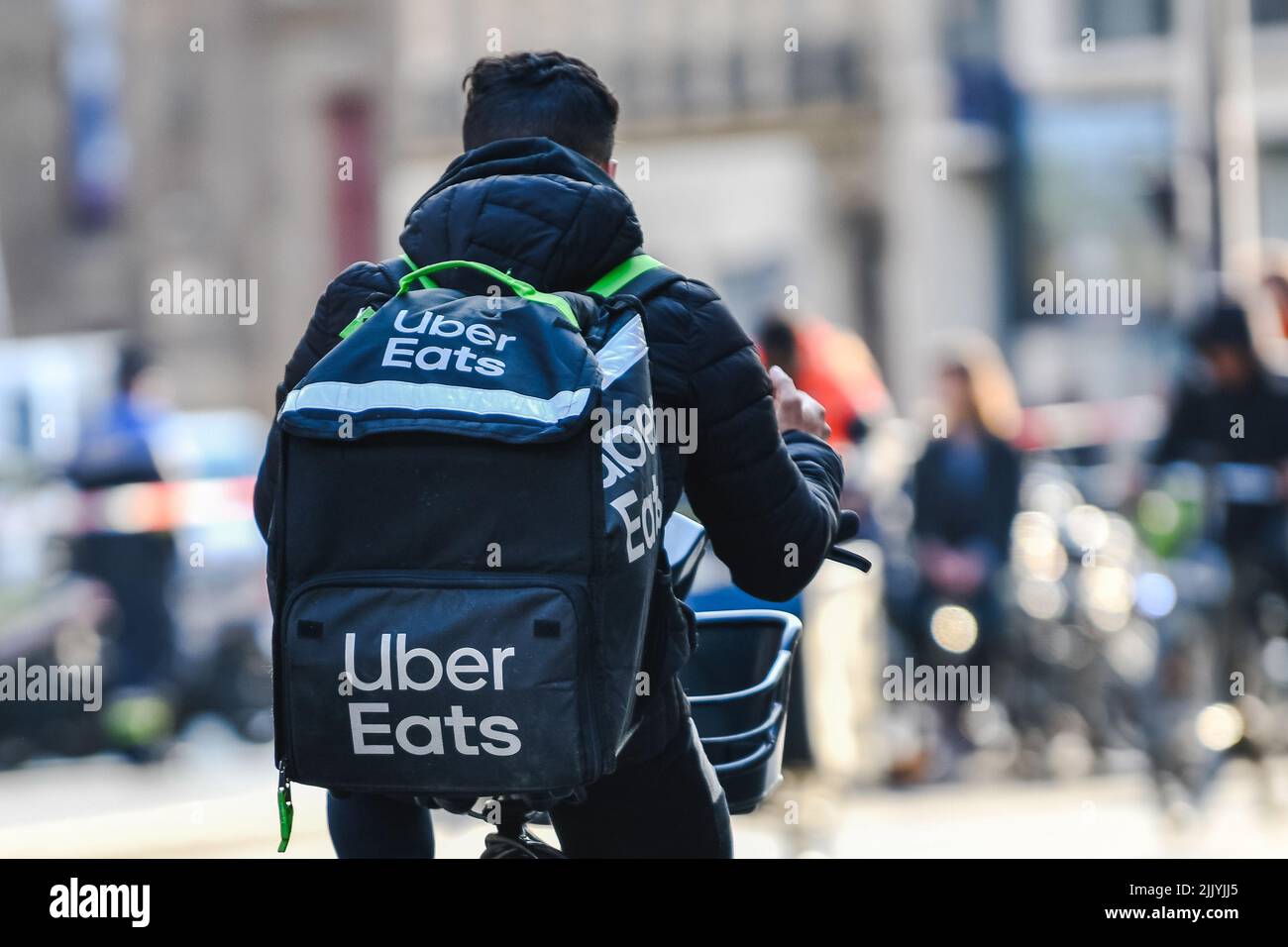 A deliver for Uber Eats on his bike (bicyle). Illustration of delivers ...