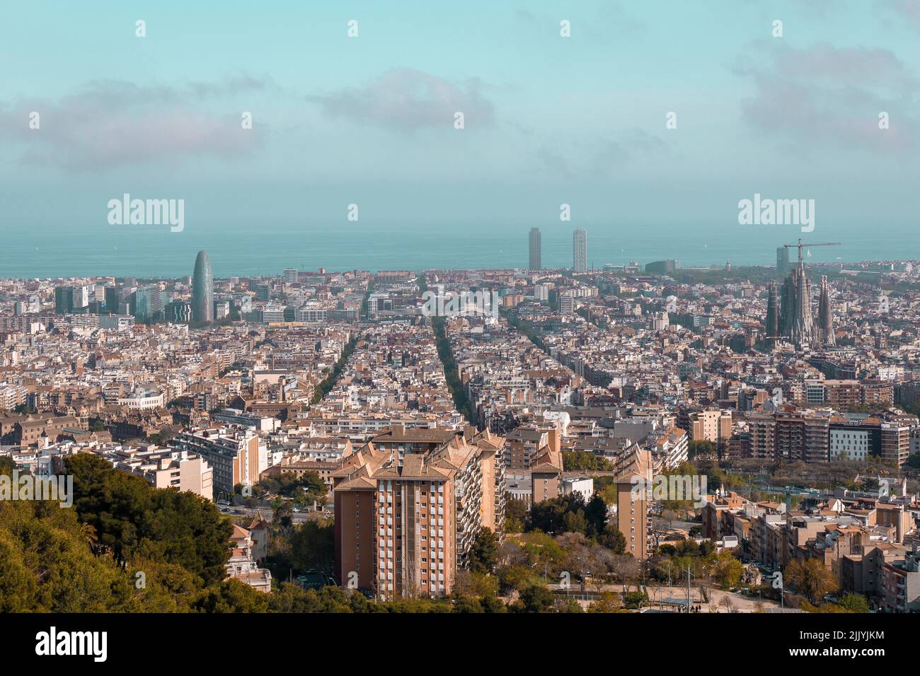 Aerial view of Barcelona city on a sunny day. Residential buildings and ...